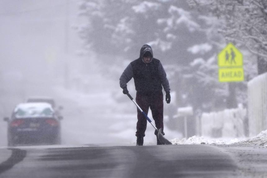 Winter storm pummels north-central US with snow, spawns tornadoes in ...