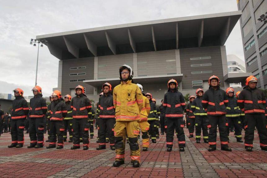 Fallen NSF firefighter Edward Go promoted; SCDF holds observance ...
