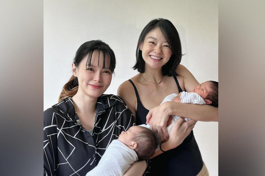 Actresses Jayley Woo and Sheila Sim cradle their newborn daughters in a photo | The Straits Times