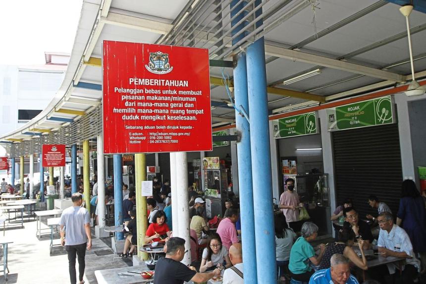 Penang city council threatens suspension after hawkers fight over where ...