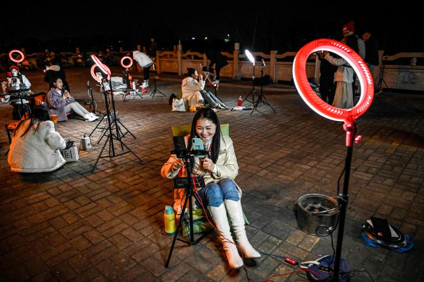 Chinese Douyin livestreamers set up stage outdoors for late-night ...
