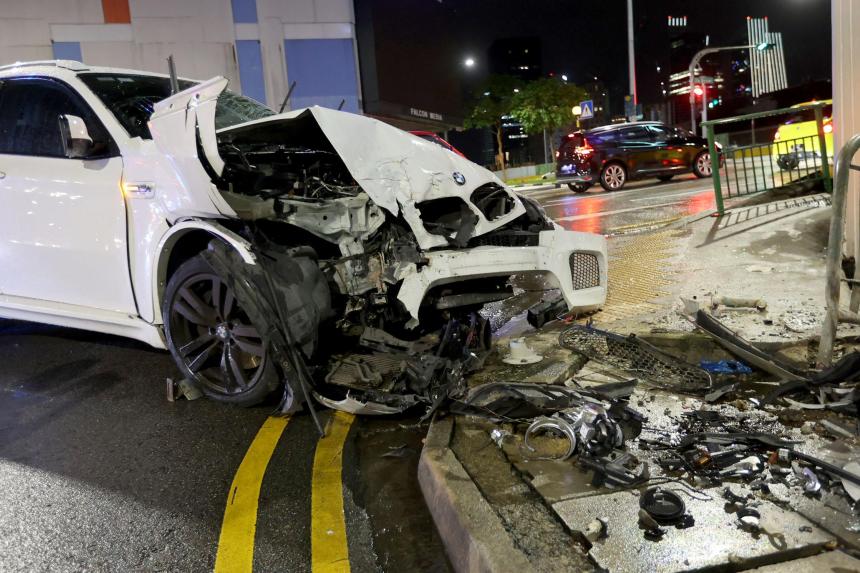 Four people taken to hospital after car hits man, crashes into building ...