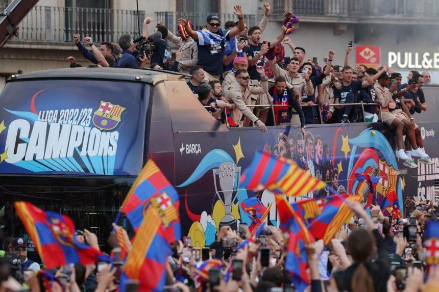 Barca fans celebrate league titles with players in parade | The Straits ...