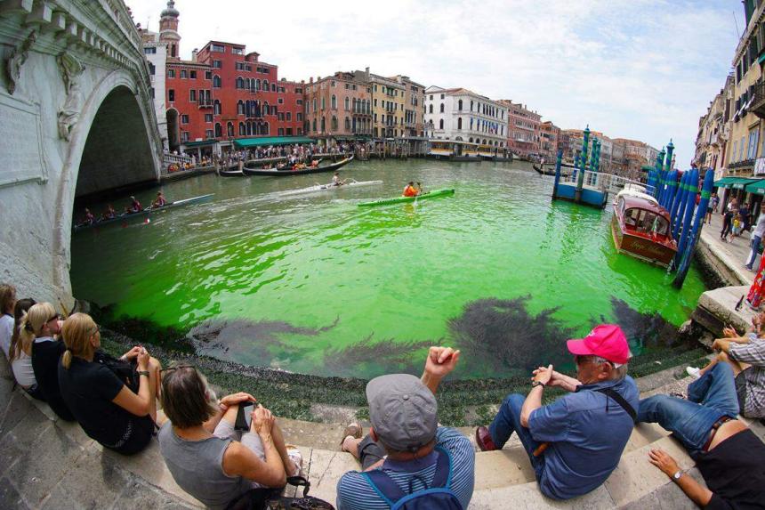 Venice’s Grand Canal turns bright green amid speculation of activist ...