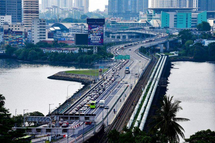 Nearly 250,000 leave Singapore via land checkpoints on Thursday ...