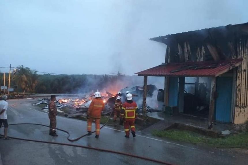 Malaysian dad throws sons from upper floor of burning building to save ...