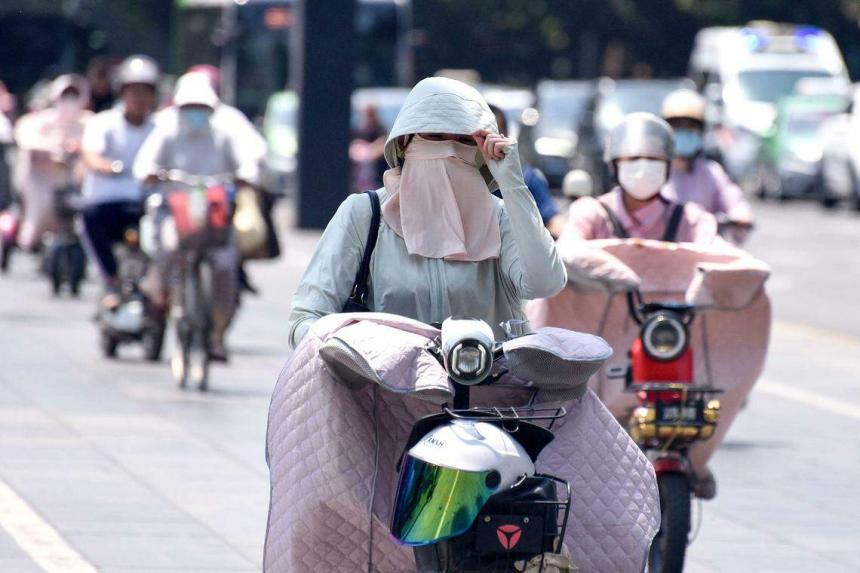 Sun jackets, face-kinis and personal fans: Chinese turn creative to ...