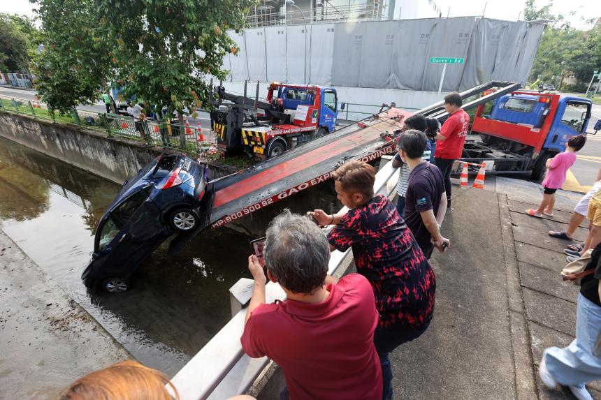 Migrant worker rescues mother and child stranded in canal after car accident in Bukit Timah ...