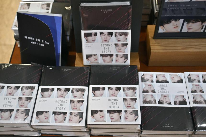 Over 200 copies of BTS’ new memoir sold on first day of S’pore sales ...