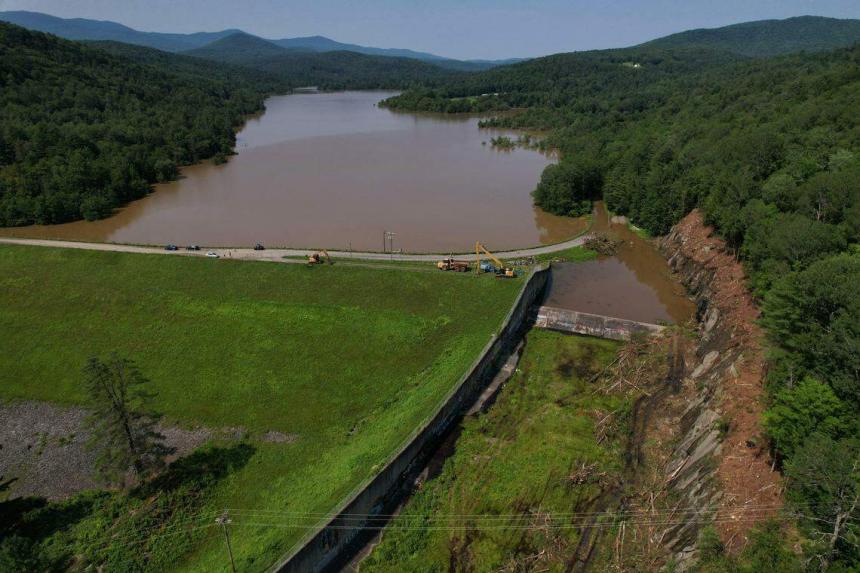 Vermont capital submerged in flood waters with dam on verge of capacity ...