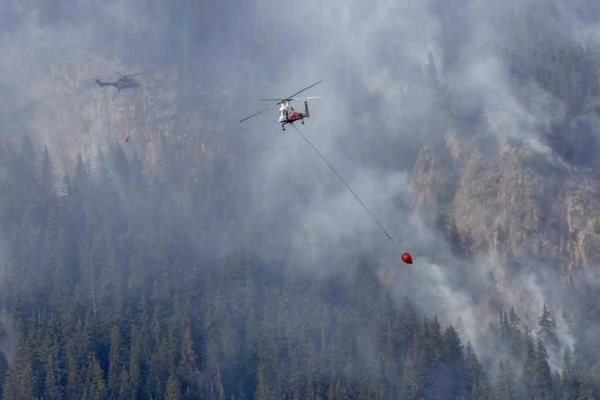 Firefighters battle to control Swiss Alps forest blaze | The Straits Times