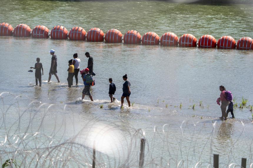 US sues Texas over floating border barriers blocking migrants | The ...