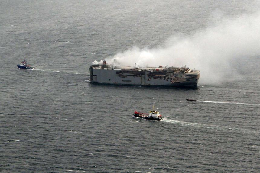 Burning car carrier off Dutch coast being towed away from shipping ...