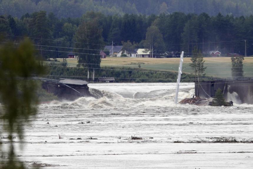 Norway river dam partly collapses after floods | The Straits Times
