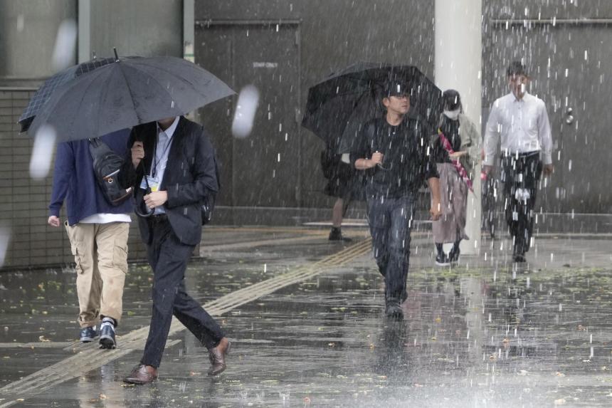 Record rain in parts of Japan after tropical storm | The Straits Times