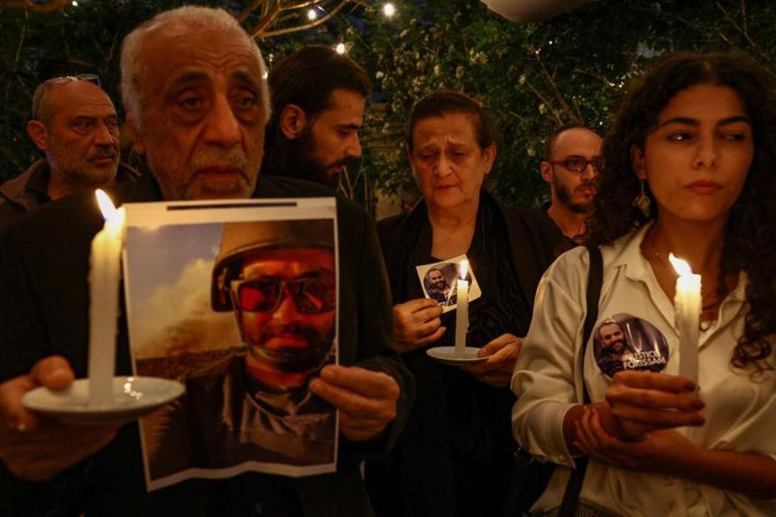 Friends, relatives hold vigil for fallen Reuters journalist Issam ...