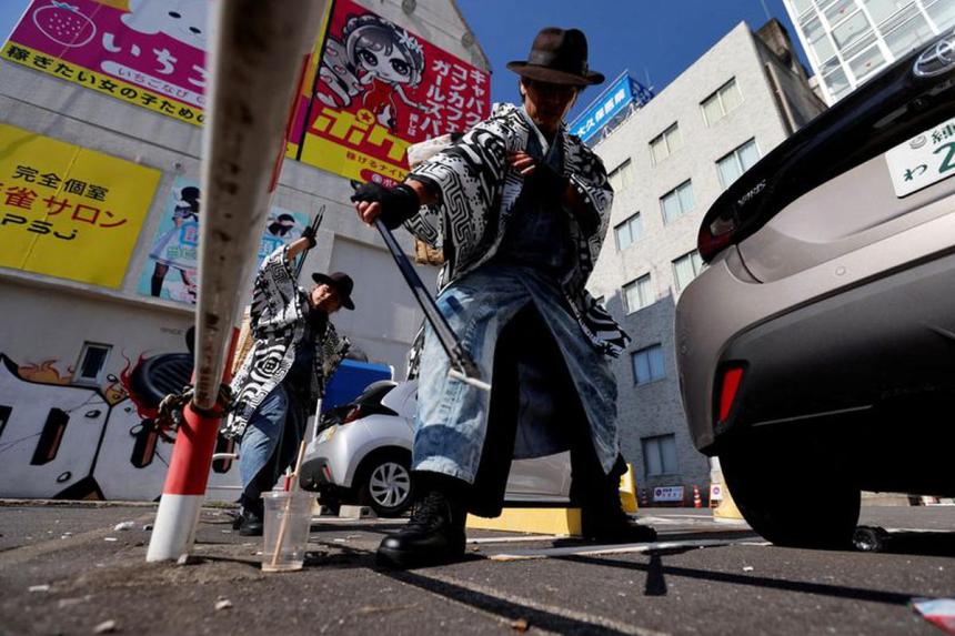Samurai trash collectors clean Tokyo streets after Halloween revels ...
