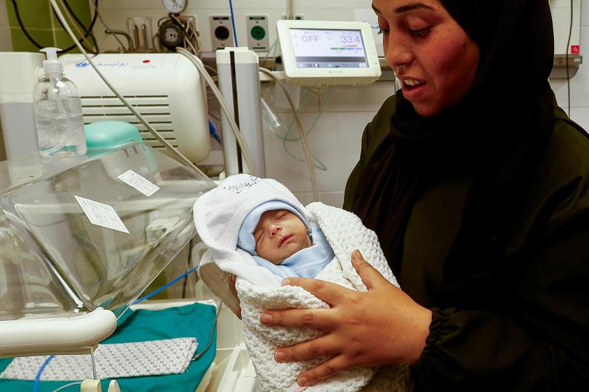 Baby Anas, rescued from Gaza's Al-Shifa Hospital, feels warmth of ...