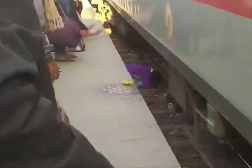 Woman in India shields her 2 kids from moving train after they fall ...