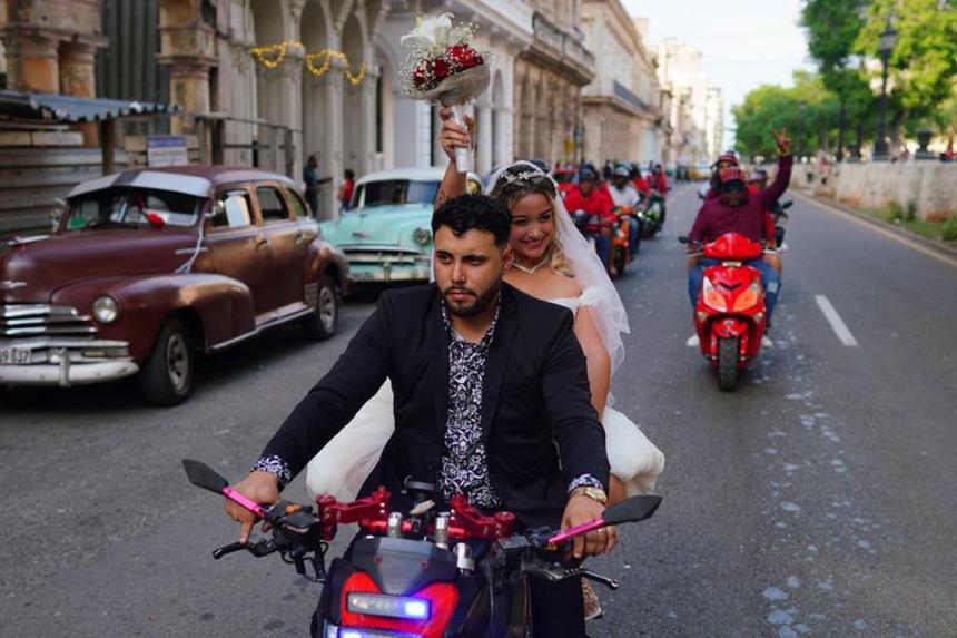 Electricity in the air for one Cuban couple's two-wheeler wedding procession | The Straits Times