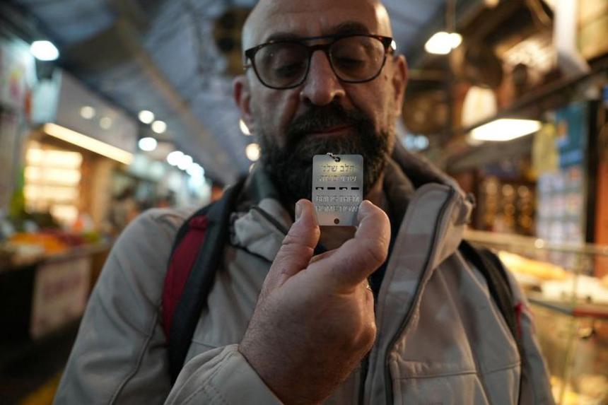 Israelis wear dog tags in solidarity with hostages and each other | The ...
