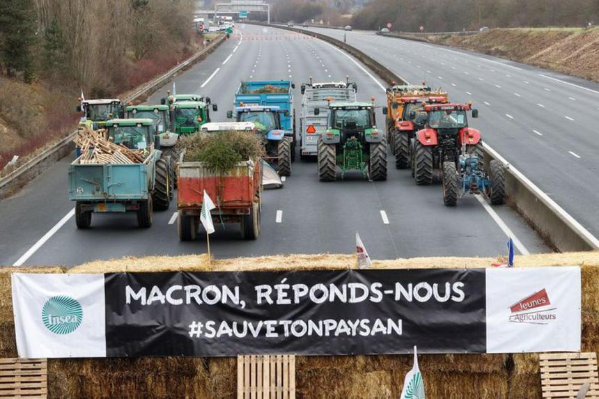 French farmers block roads with tractors, press government for action ...
