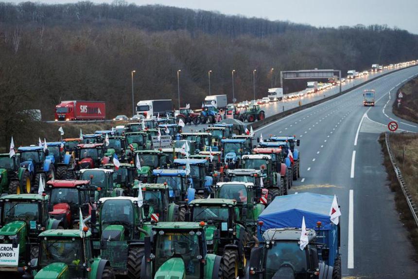 French farmers block roads with tractors, press government for action ...