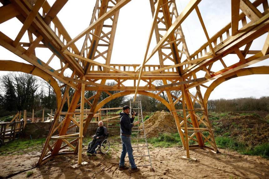 Two friends build Eiffel Tower from recycled wood ahead of Olympics ...