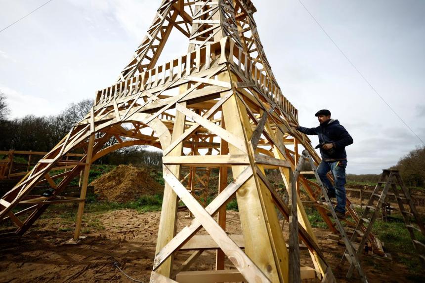 Two friends build Eiffel Tower from recycled wood ahead of Olympics ...
