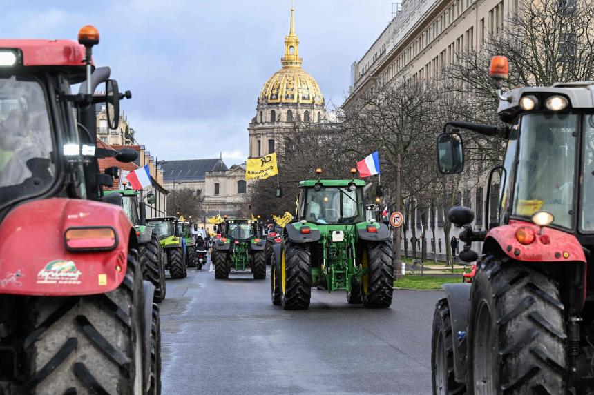 French farmers roll into Paris, prepare a tough welcome for Macron at ...
