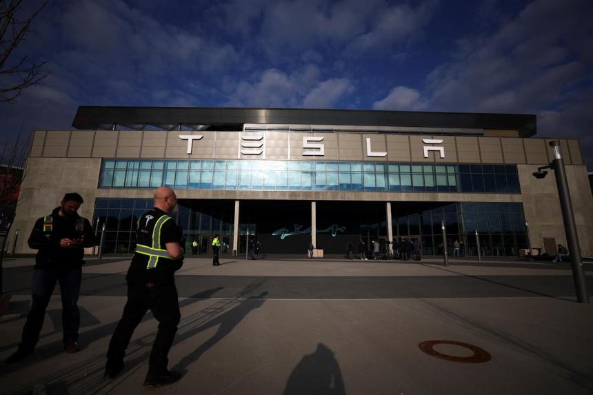 Tesla Germany halts work as Musk calls suspected arson 'extremely dumb ...