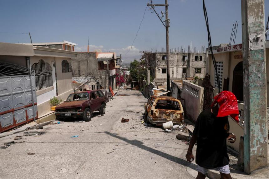 Haiti suspected gang members set on fire as conflict spreads to capital ...