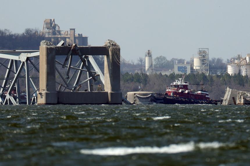 Huge crane in place to clear Baltimore bridge debris as crews assess ...
