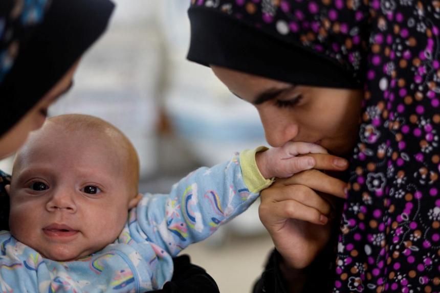 Gaza war separates parents from their new born baby | The Straits Times
