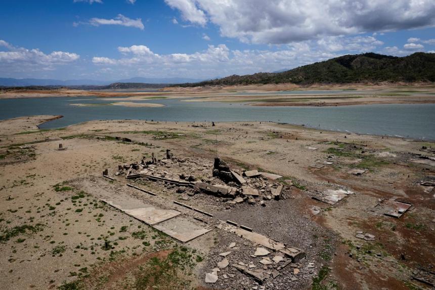 Parched Philippine dam reveals centuries-old town, luring tourists ...