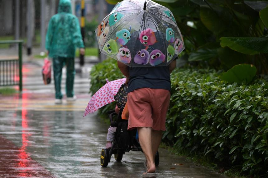Heavy rain prompts flood warnings for many areas of Singapore, delays ...