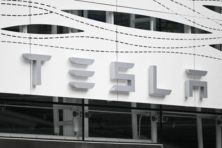 Tesla lays off more staff in software, service teams, says report | The ...