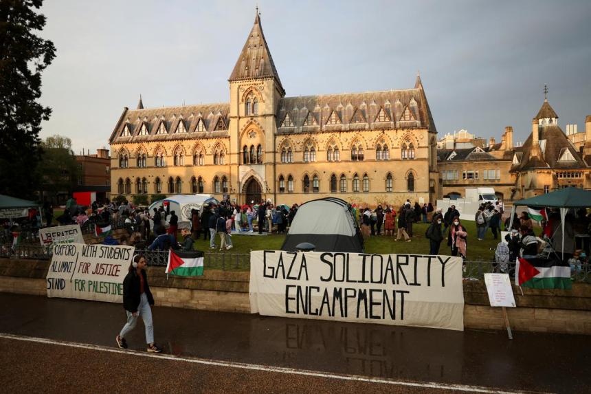 With bright tents and a sombre mood, UK student protesters show ...