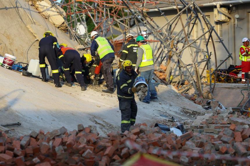 Rescuers search for survivors after South Africa building collapses ...