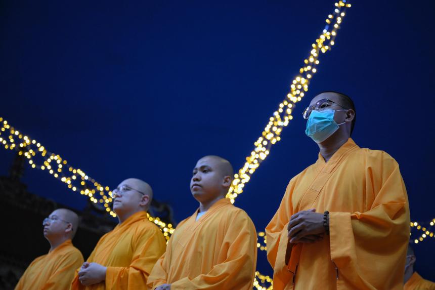 Monastery marks Vesak Day with ‘three steps, one bow’ ritual | The Straits Times