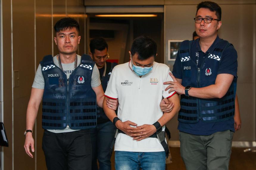 Two men extradited from Malaysia for alleged involvement in malware scams against Singaporeans ...