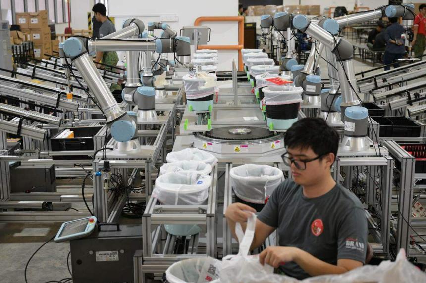 Soldiers don exoskeleton suits, operate automated packing line to ...