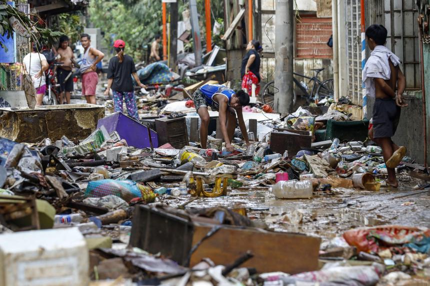 ‘Back to zero’: Manila flood victims face daunting task of cleaning up ...