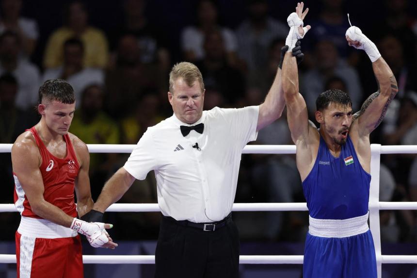 Boxing-Reigning champions Jalolov, Harrington win, Australia's ...