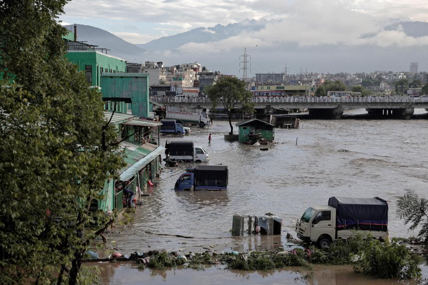 Nepal flood waters smash through village | The Straits Times