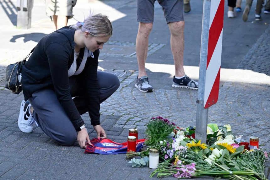 German city's festival succumbs to grief after fatal stabbings | The ...