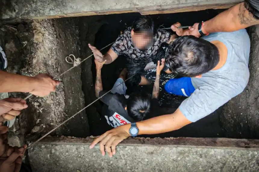 Woman in Thailand falls 2m after manhole cover gives way, trapped ...