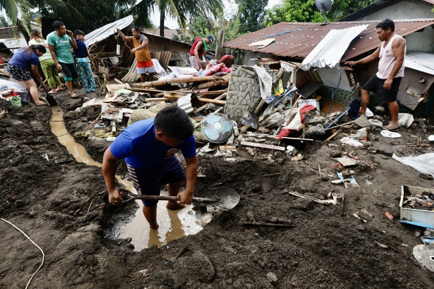 Philippine rescuers battle flood waters to reach stranded residents ...