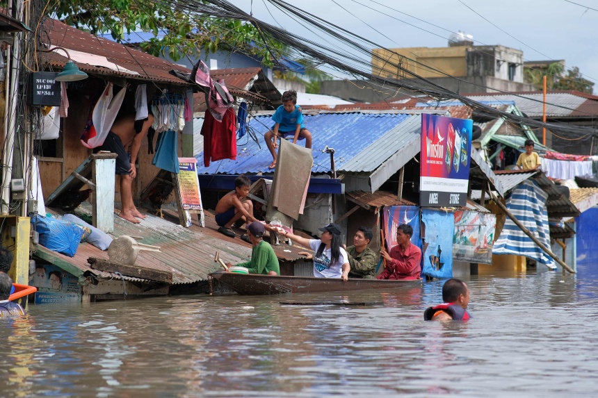 Philippine rescuers battle flood waters to reach stranded residents ...