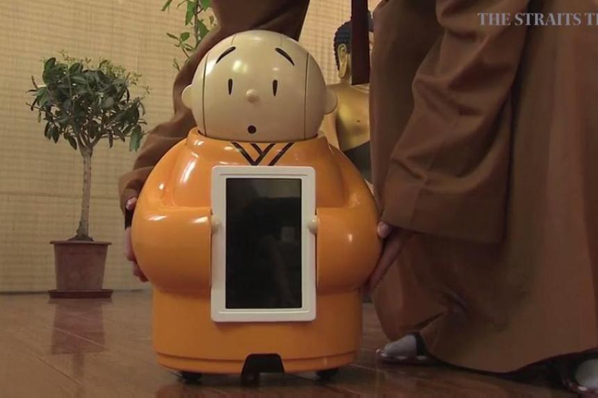 Robot monk that chants mantras, answers questions, spreads Buddhism ...